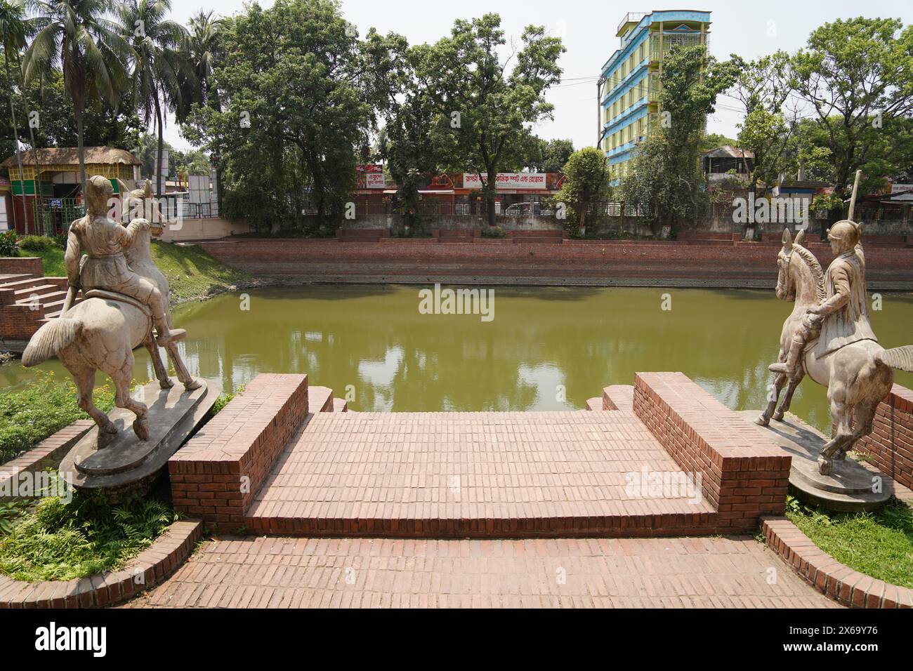 Equestrian statues at the ghat of frontal pond. Baro Shardarbari ...