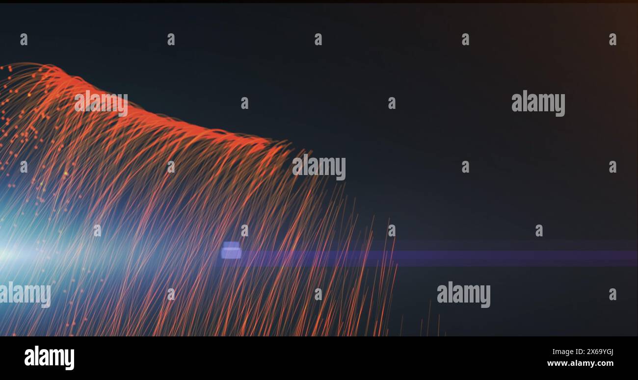Image of orange light trails falling and blue light spot against black ...