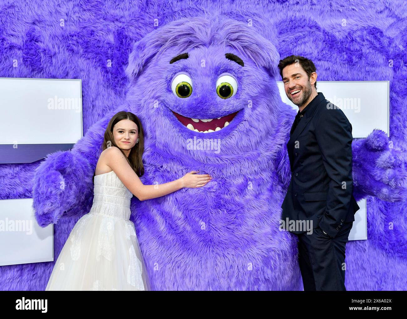 Cailey Fleming, left, and John Krasinski pose with the character "Blue ...