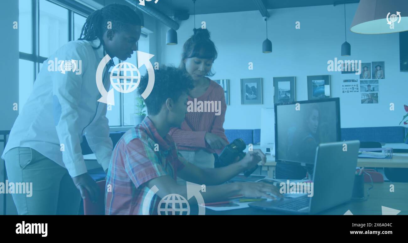 Image of arrows around globe over diverse coworkers looking model ...