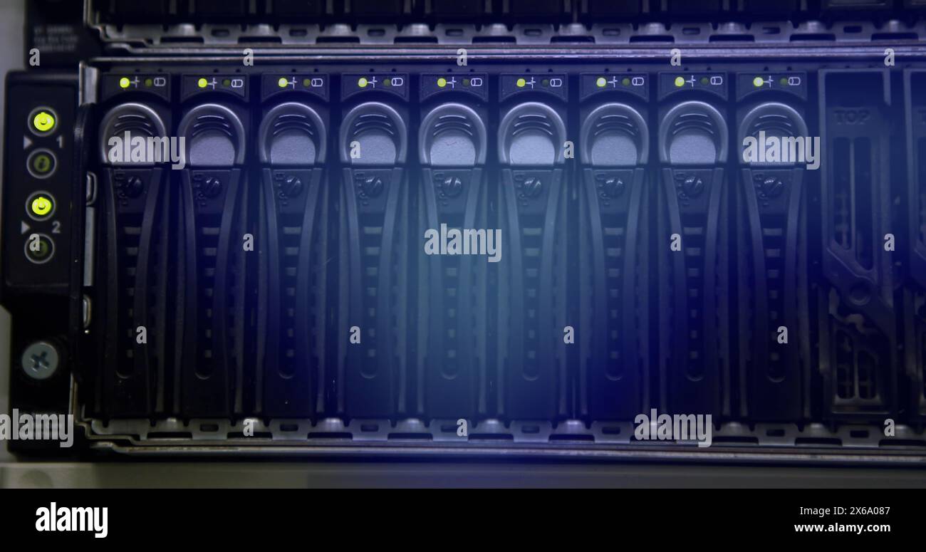 Rows of hard drives glowing in blue inside server rack Stock Photo - Alamy