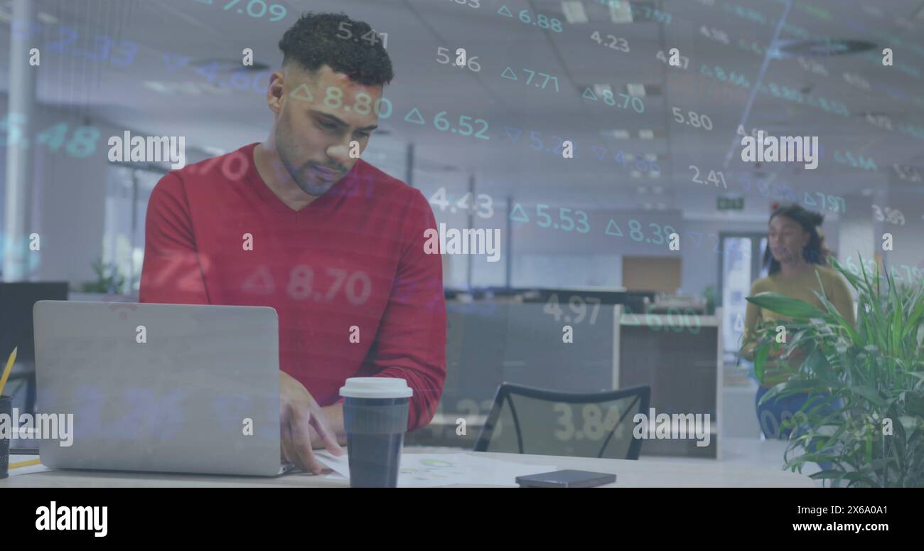 Biracial coworker wearing red is typing on laptop, diverse coworker in ...