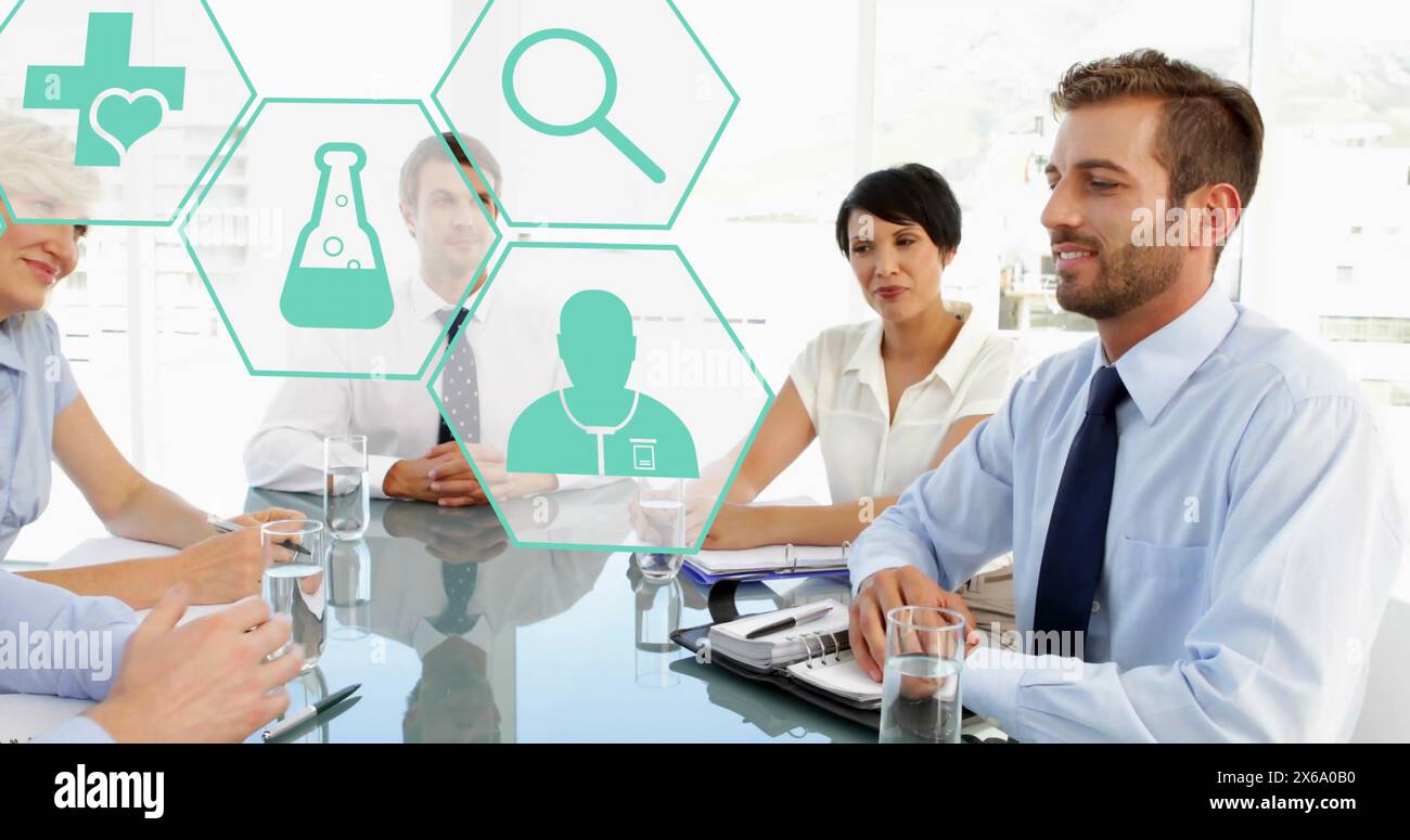 Group of friends discussing at table, showing diverse team Stock Photo ...