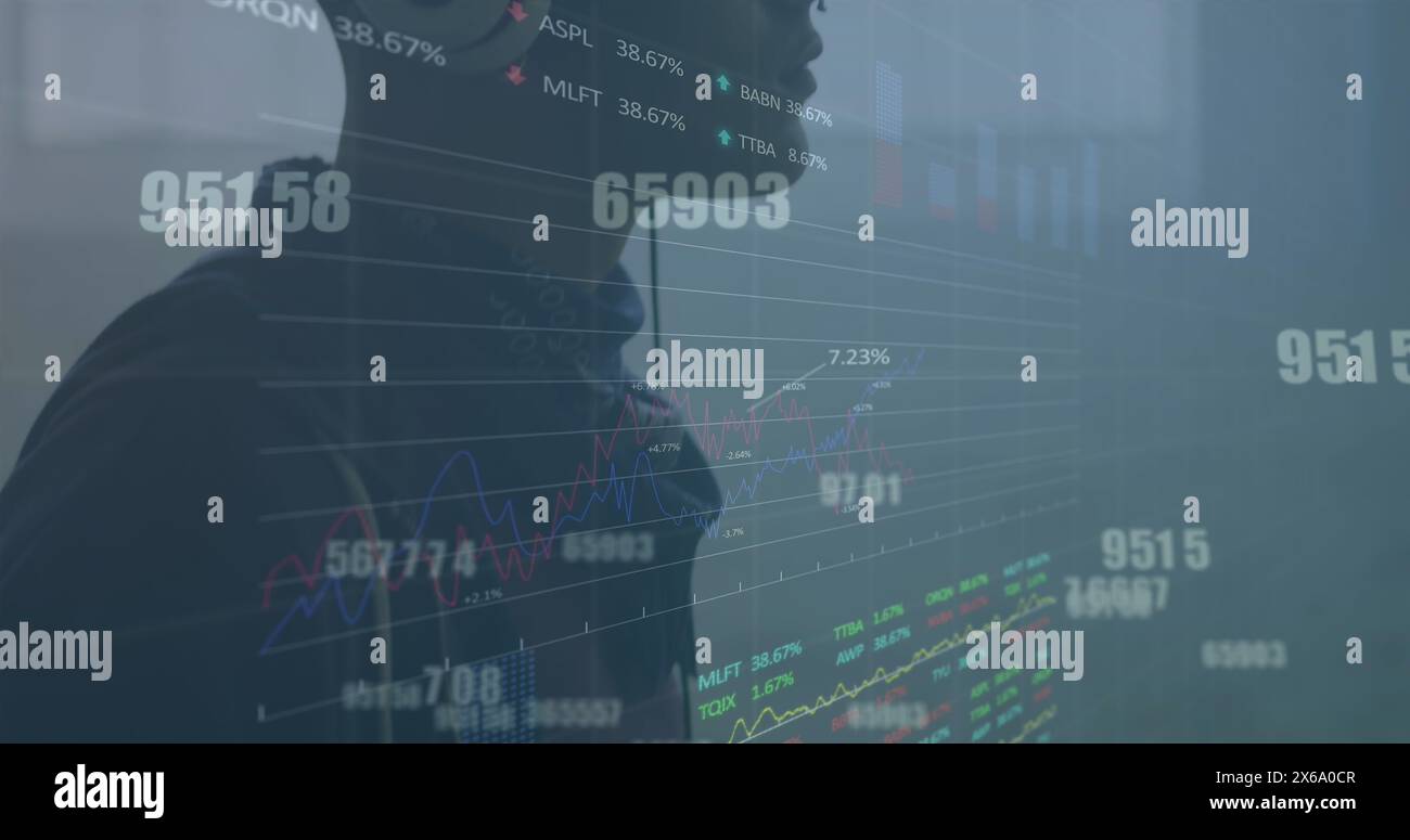 Image of graphs, numbers, trading boards, biracial man listening to ...