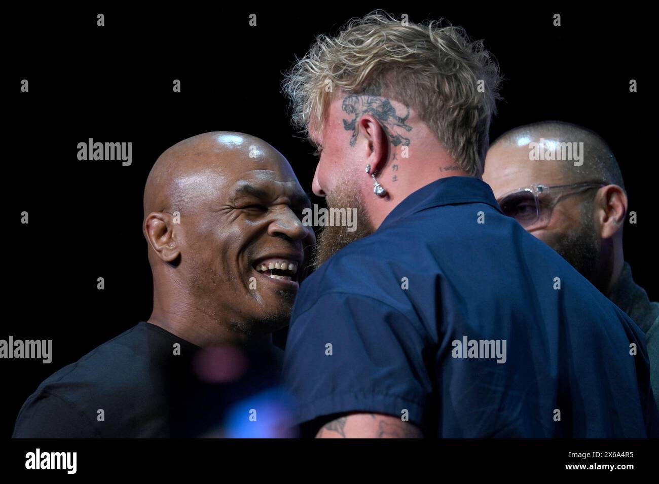 (L-R) Mike Tyson and Jake Paul stand face to face onstage at the Apollo ...