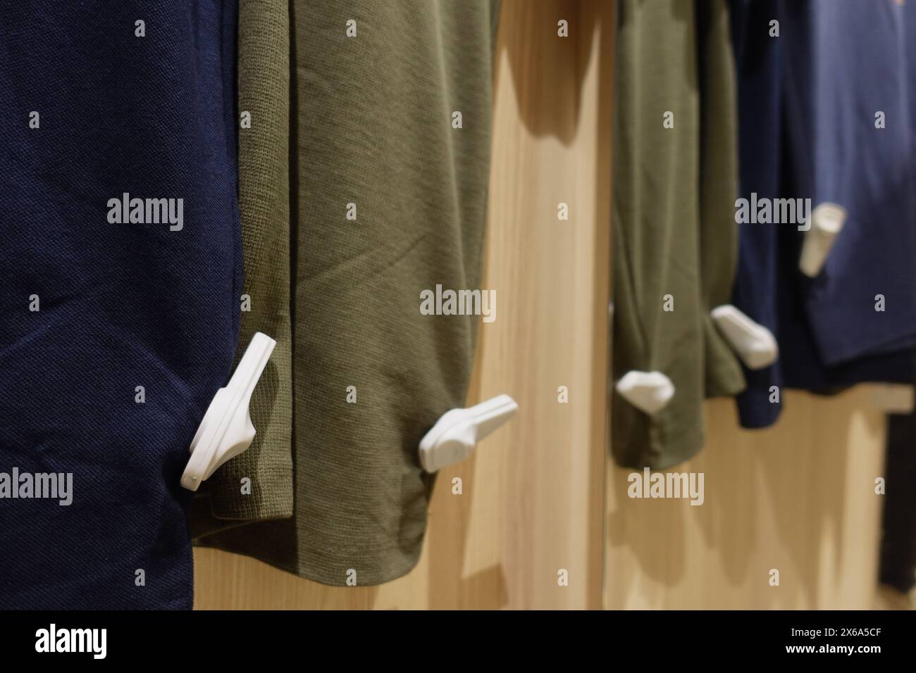 Clothing security tag on a shirt Stock Photo - Alamy