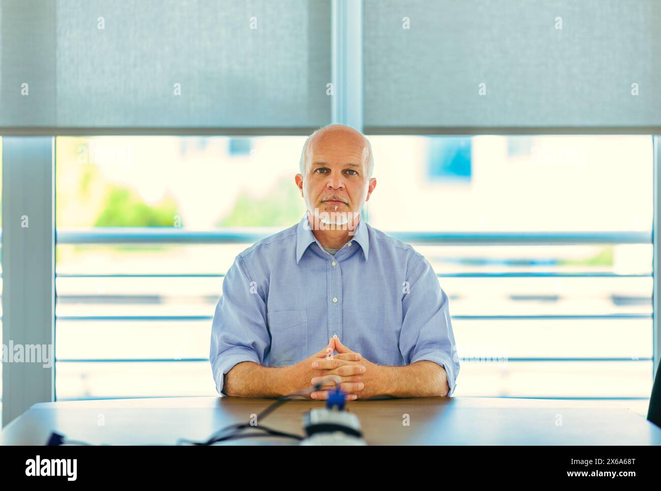 Serious and poised, the man engages in a moment of reflection during a ...