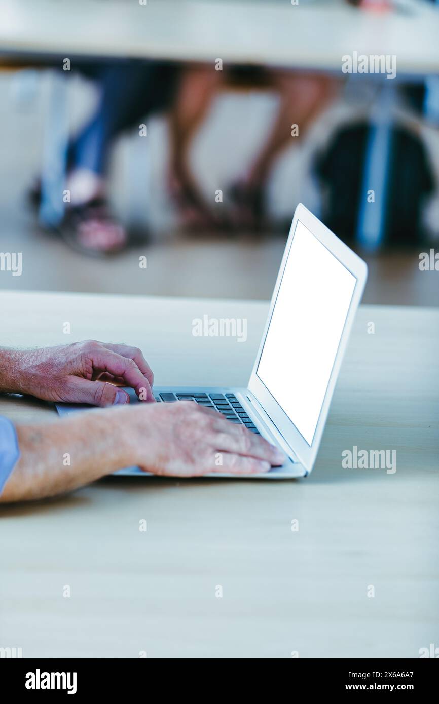 Focused and industrious, the man's hands navigate the keyboard of his ...