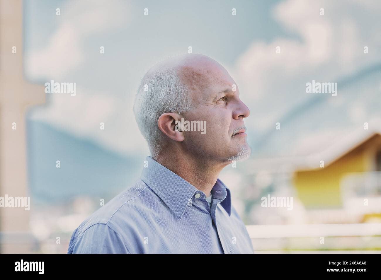 Middle-aged man contemplates the serene landscape, a gentle expression ...