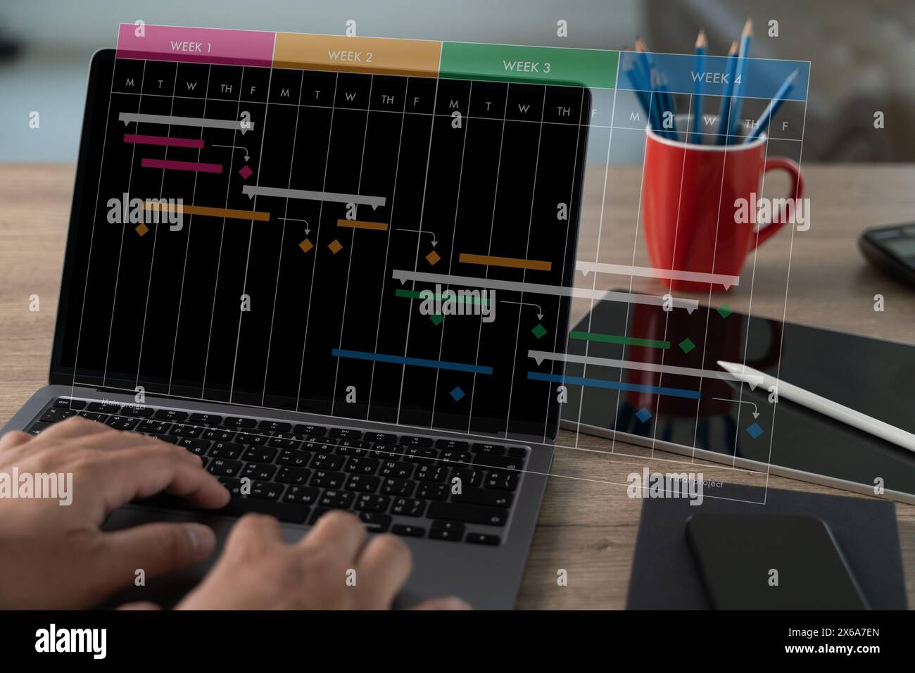 Project manager leading the computer interface update chart scheduling ...