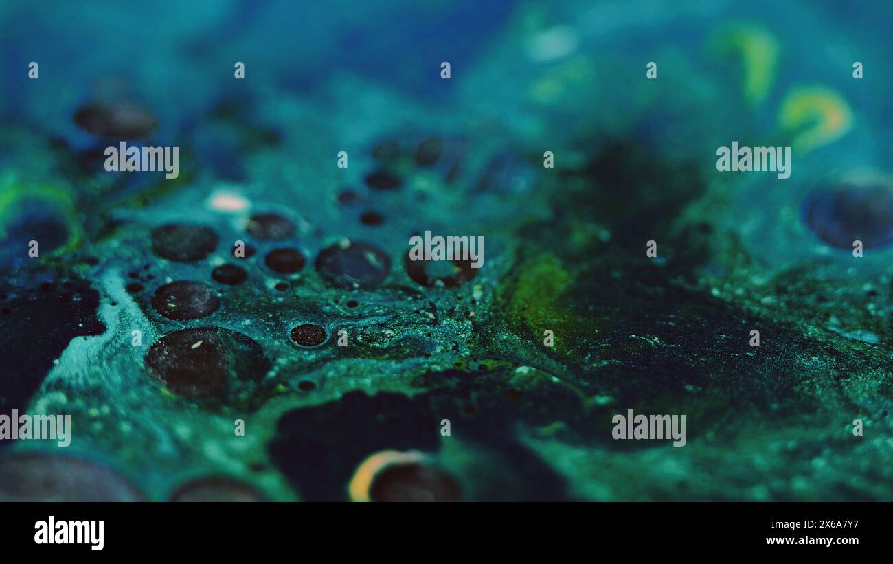Paint bubbles. Oil fluid. Ink mix. Defocused blue green black color ...