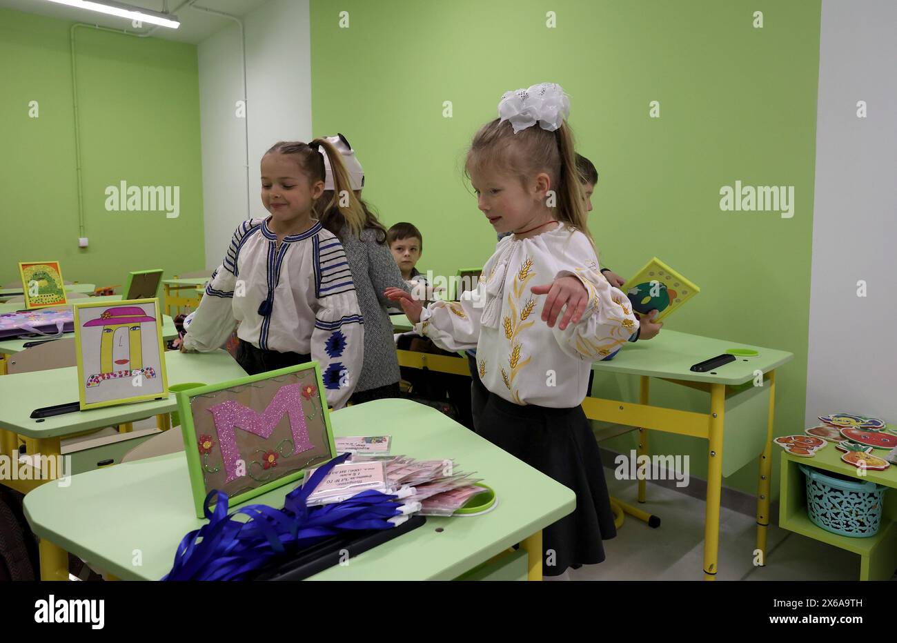 Non Exclusive: KHARKIV, UKRAINE - MAY 13, 2024 - Girls stay in a classroom at an underground ...