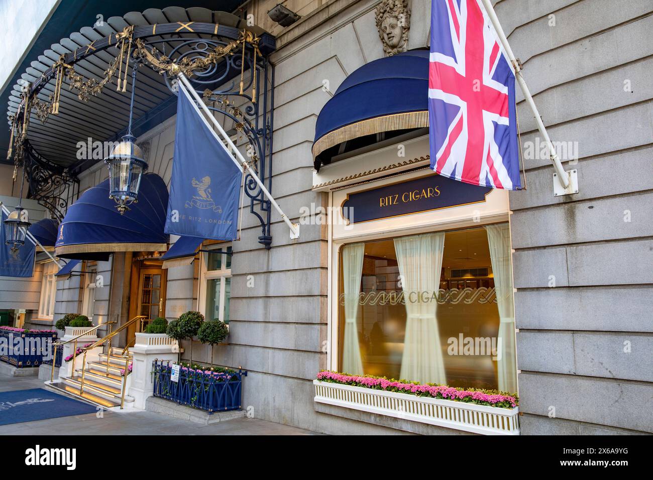The Ritz Hotel in London,England, Union Jack beside the hotel entrance ...