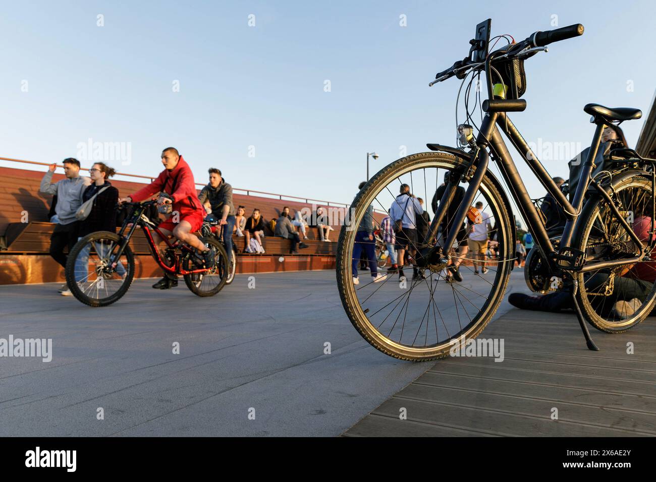 People enjoy the sunset on the new pedestrian and bicycle bridge over ...