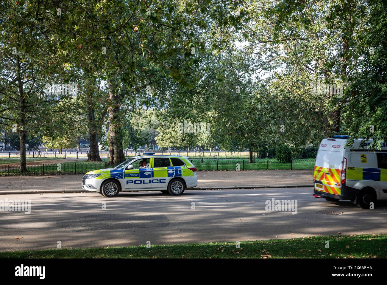 Hyde Park London, BMW police car and Metropolitan police van on patrol ...