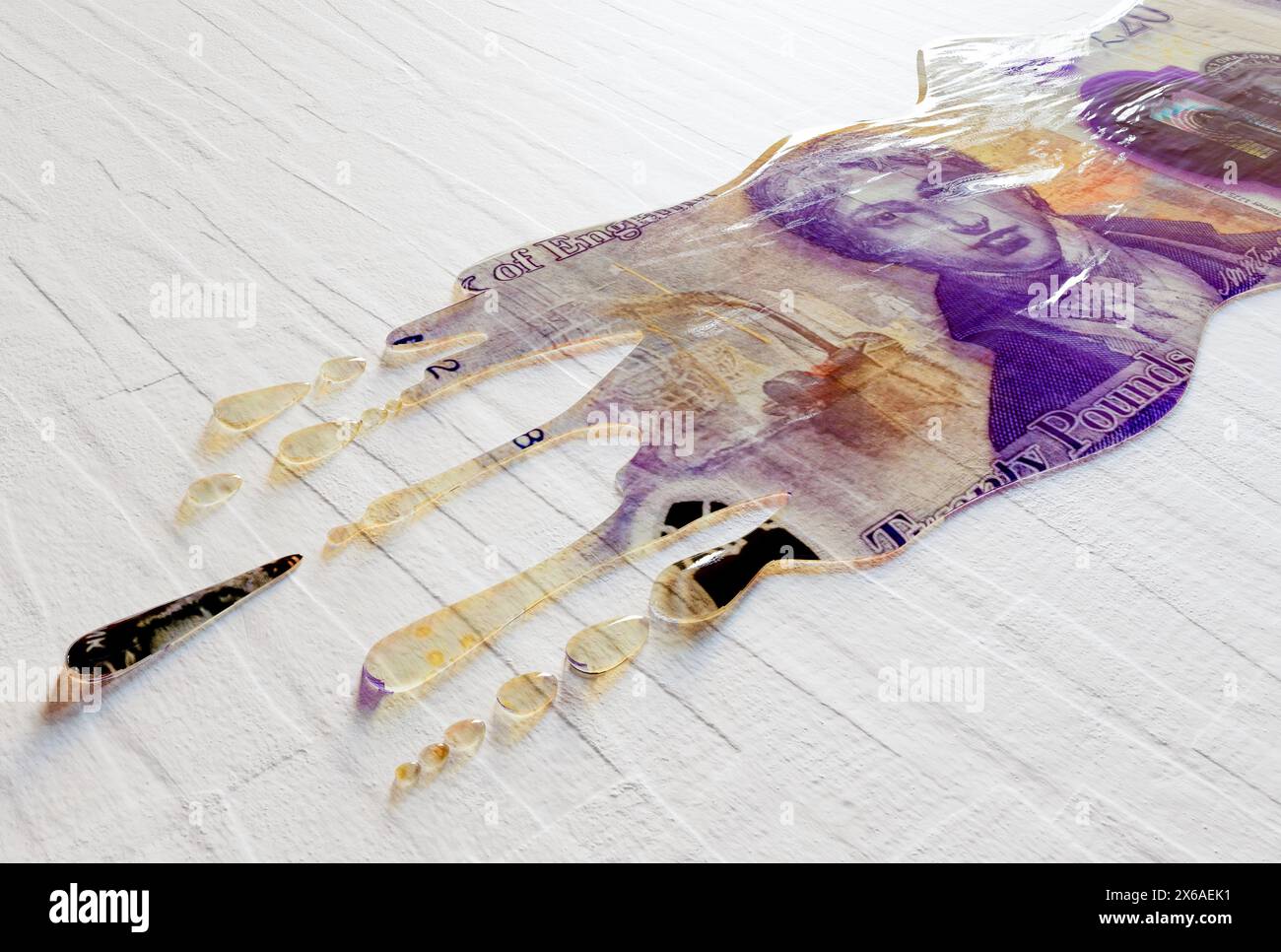 A concept image showing a regular British pound banknote that is melted ...