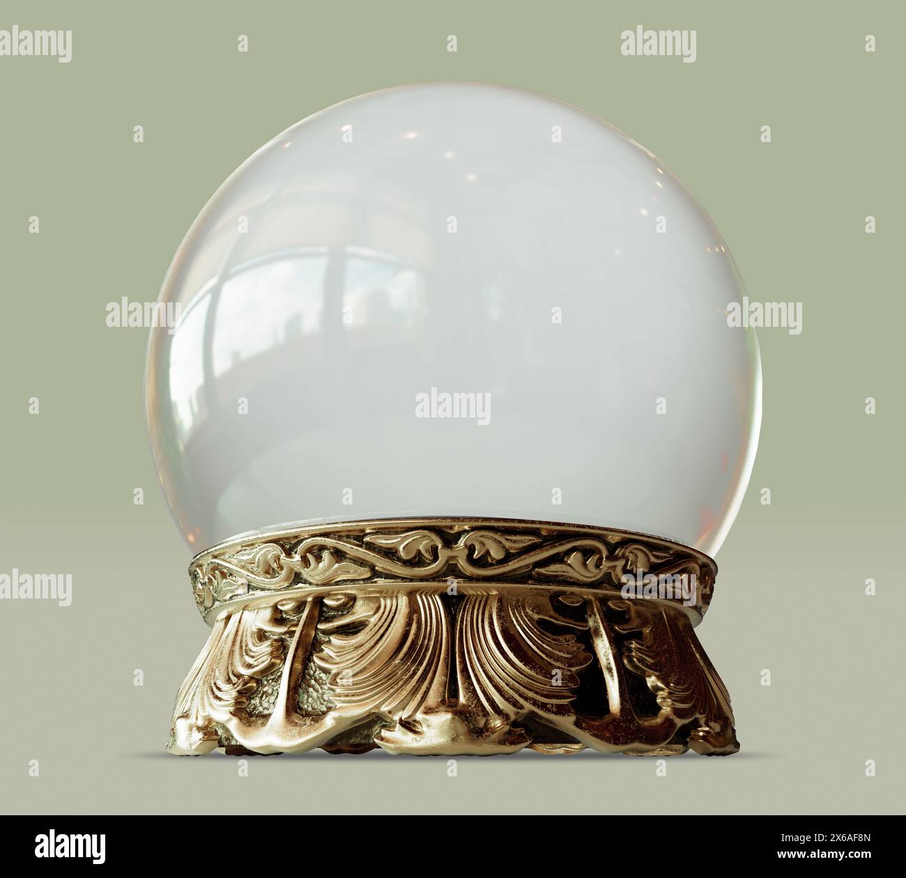 A fortune teller crystal ball with an ornate decorated brass base in an ...