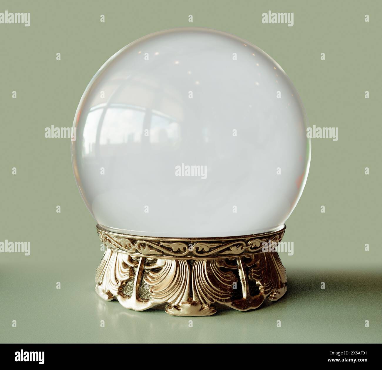 A fortune teller crystal ball with an ornate decorated brass base in an ...