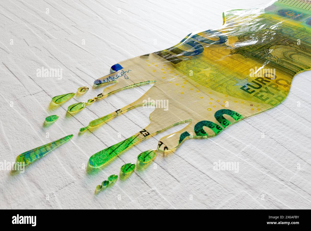 A concept image showing a regular European Euro banknote that is melted ...