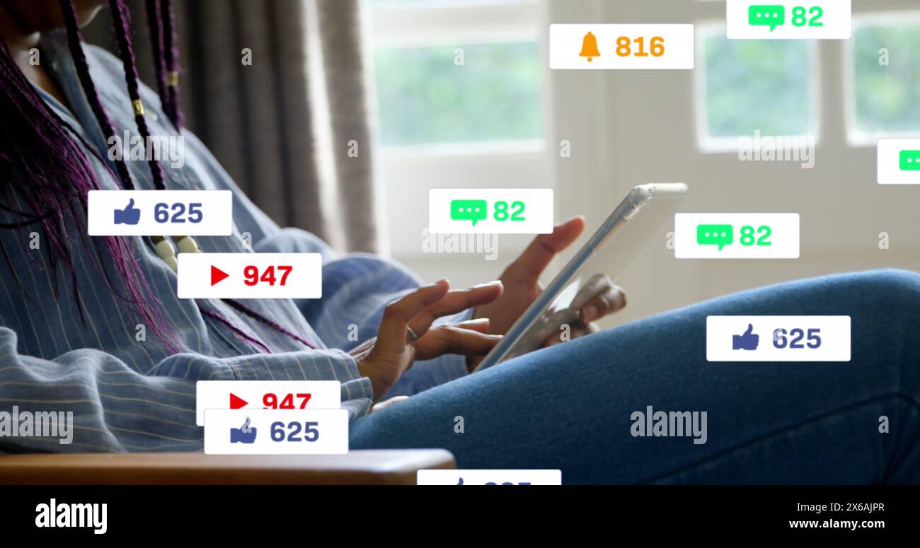 Image of multiple social media icons over mid section of a woman using ...