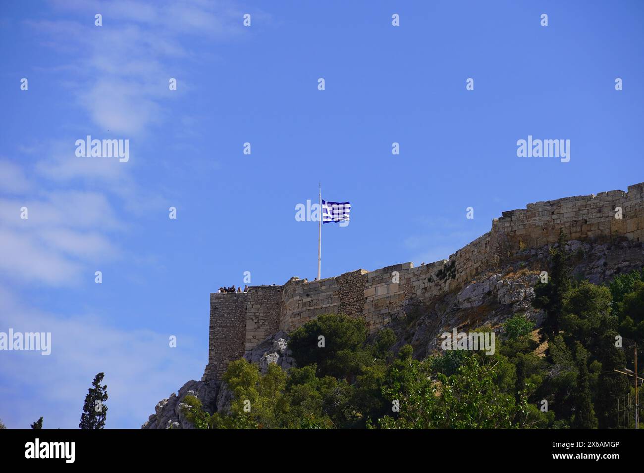 The Greek national flag, flying on the Acropolis hill, in Athens ...