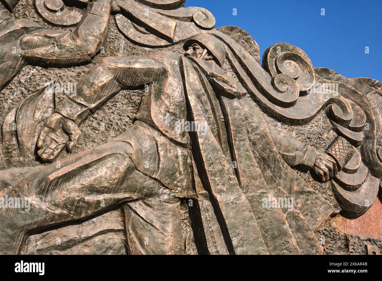 A soldier throwing a hand grenade. View of the main bronze frieze at the Soviet Great Patriotic ...