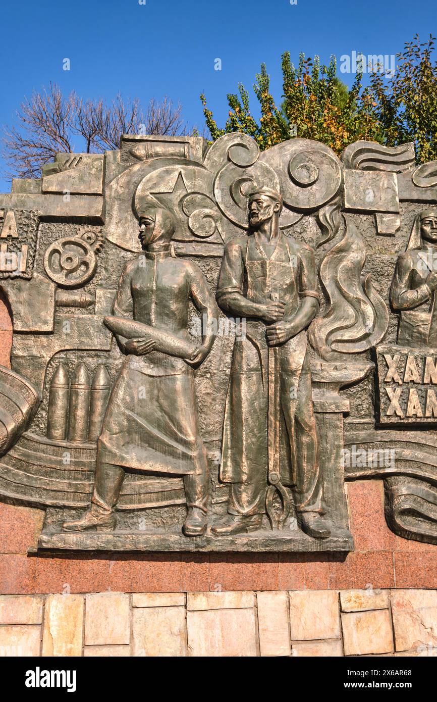 Workers at a bomb, munitions factory. View of the main bronze frieze at the Soviet Great ...