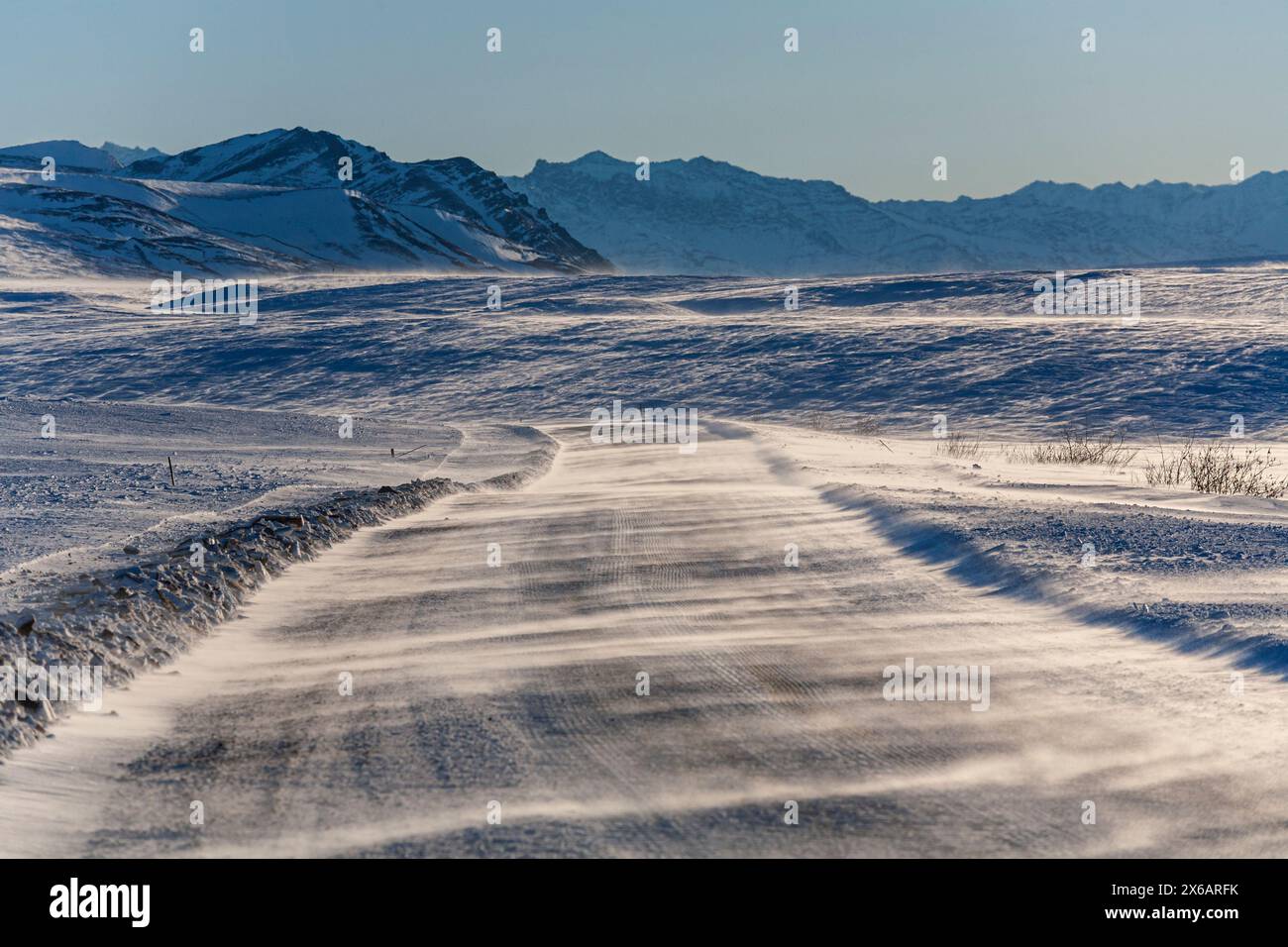 Snow covered gravel road in mountains, Dalton Highway, Brooks Range ...
