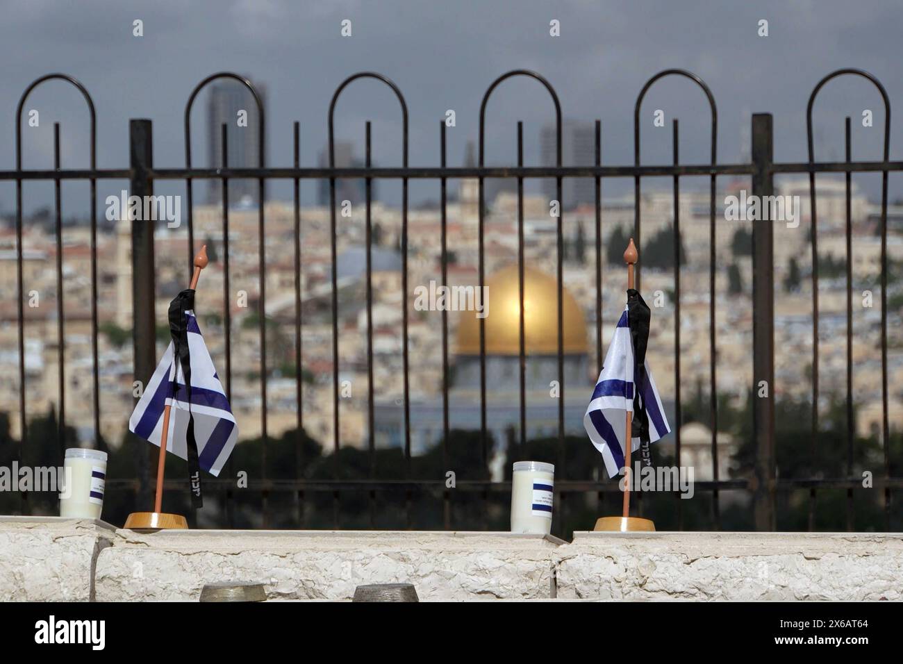 JERUSALEM - MAY 12: Israeli national flags with black mourning ribbons ...