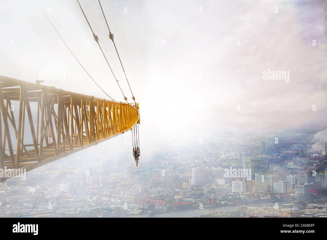 about the boom hoisting of crane at construction site and blue sky by ...