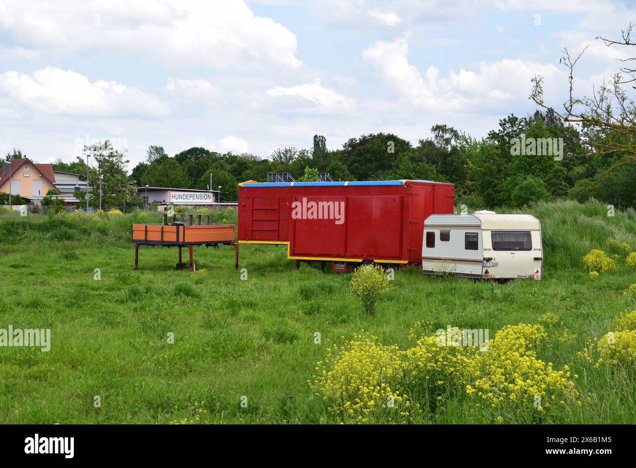 Circus vehicles in spring blooming landscape Stock Photo - Alamy