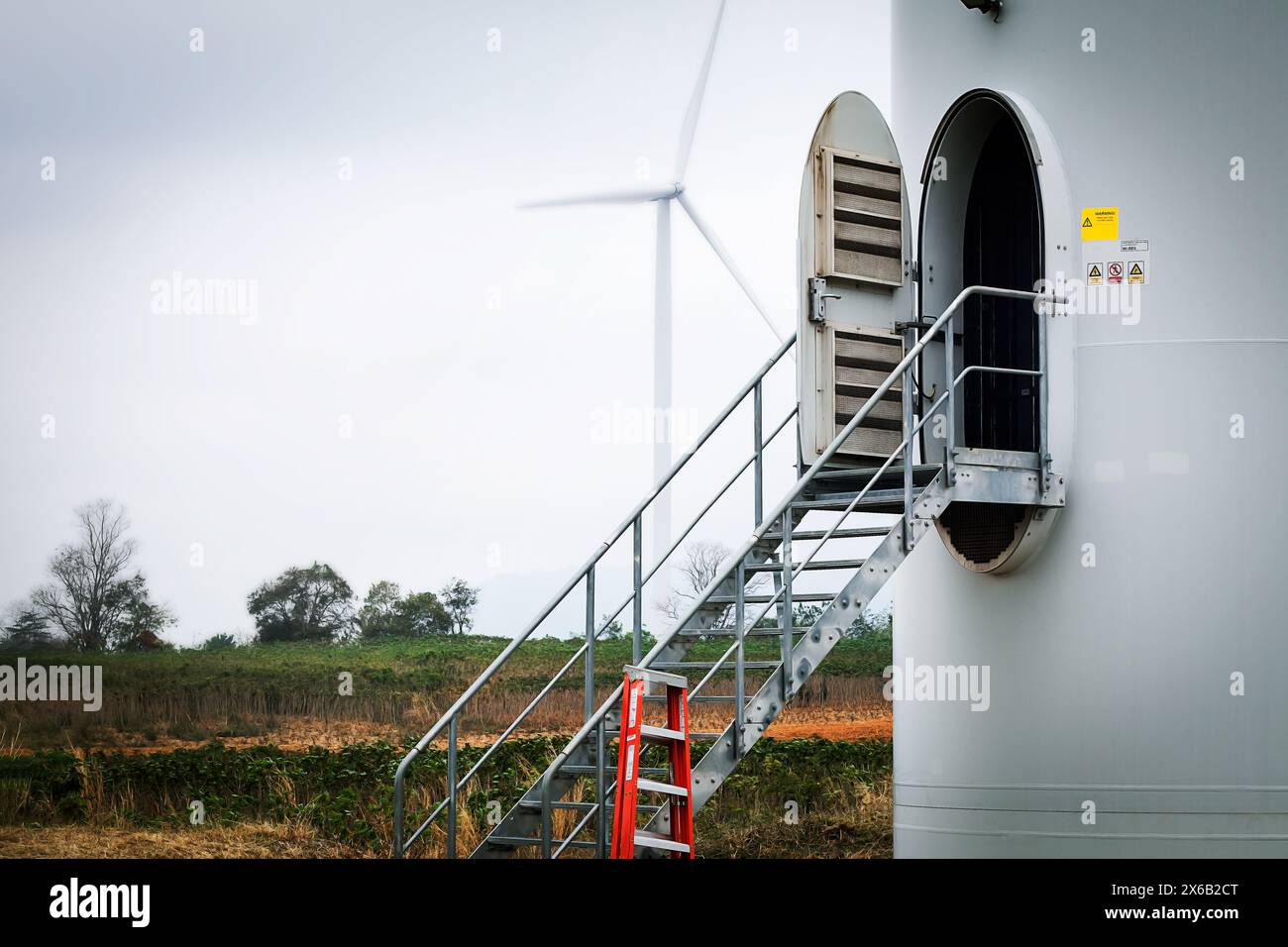 the wind turbine door and a lander with sunset at the solar farm among ...