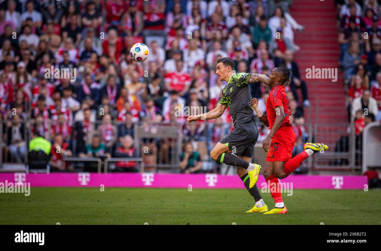 Munich, Germany.12th Mai 2024. Cedric Zesiger (Wolfsburg) Alphonso ...
