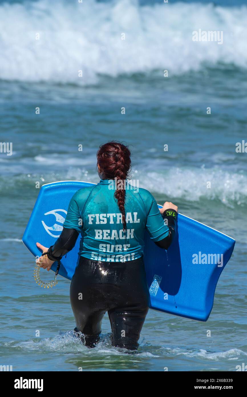 A surfing novice having fun during a body boarding boogie boarding ...