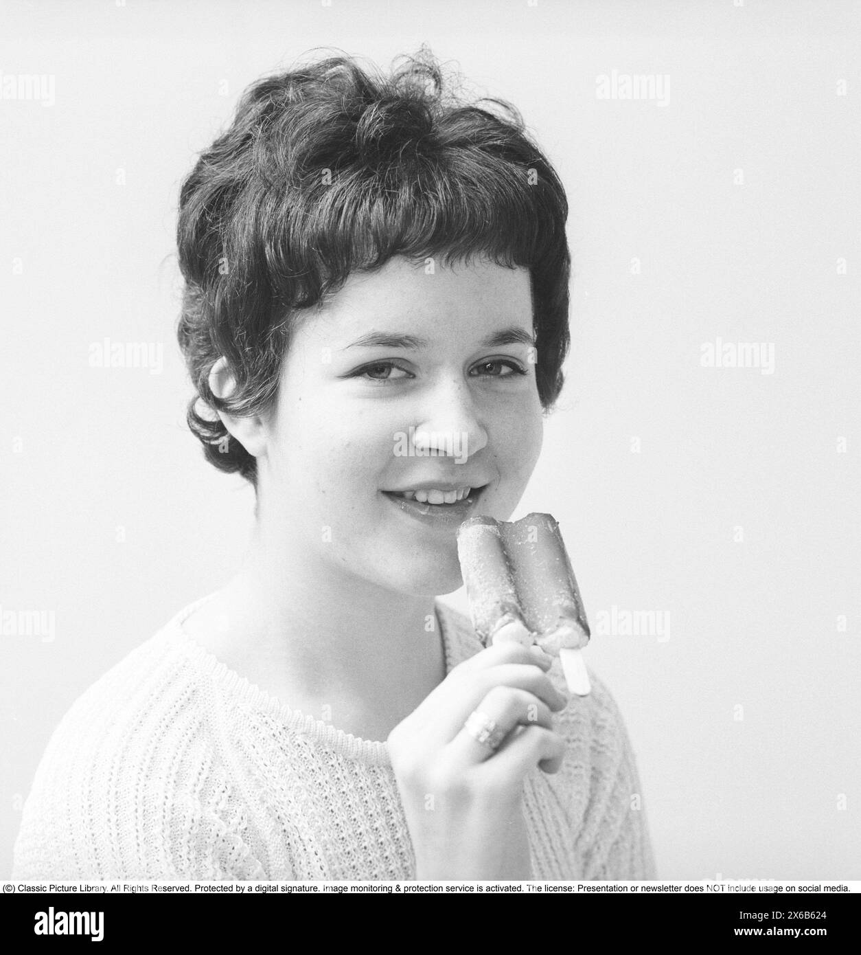 ice-cream-in-the-1960s-a-young-girl-is-eating-ice-cream-bar-1961