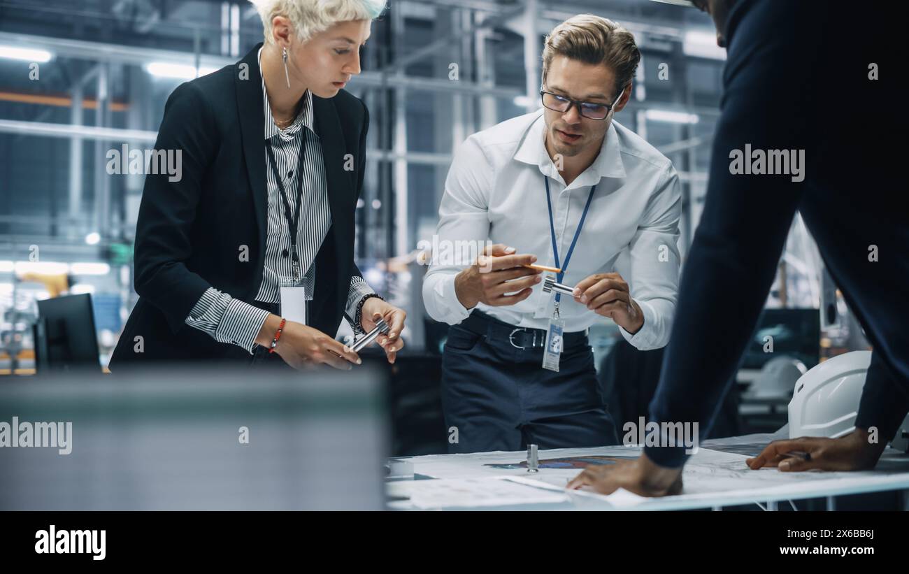 Young Diverse Team of Automotive Engineers Working in Office at Car ...