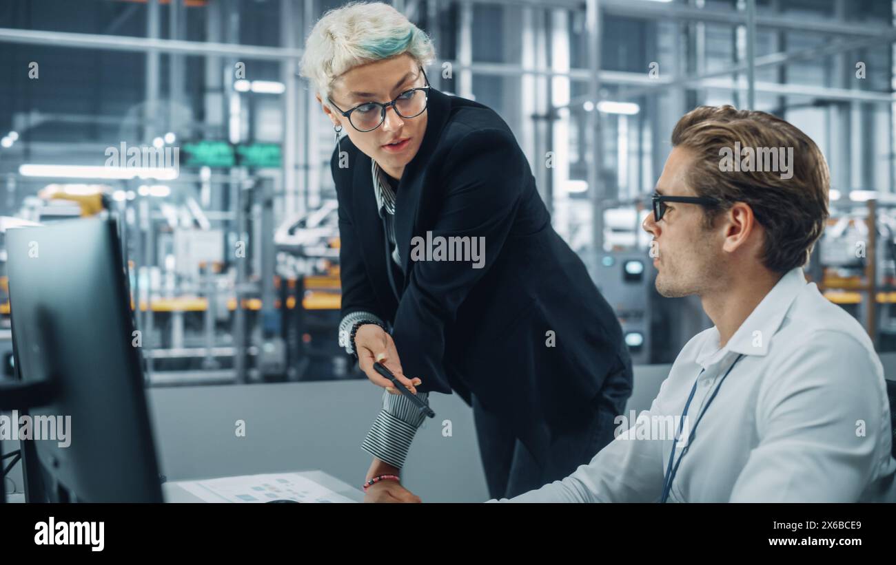 Two Automotive Engineers Discussing Concept Car Blueprints on Desktop ...