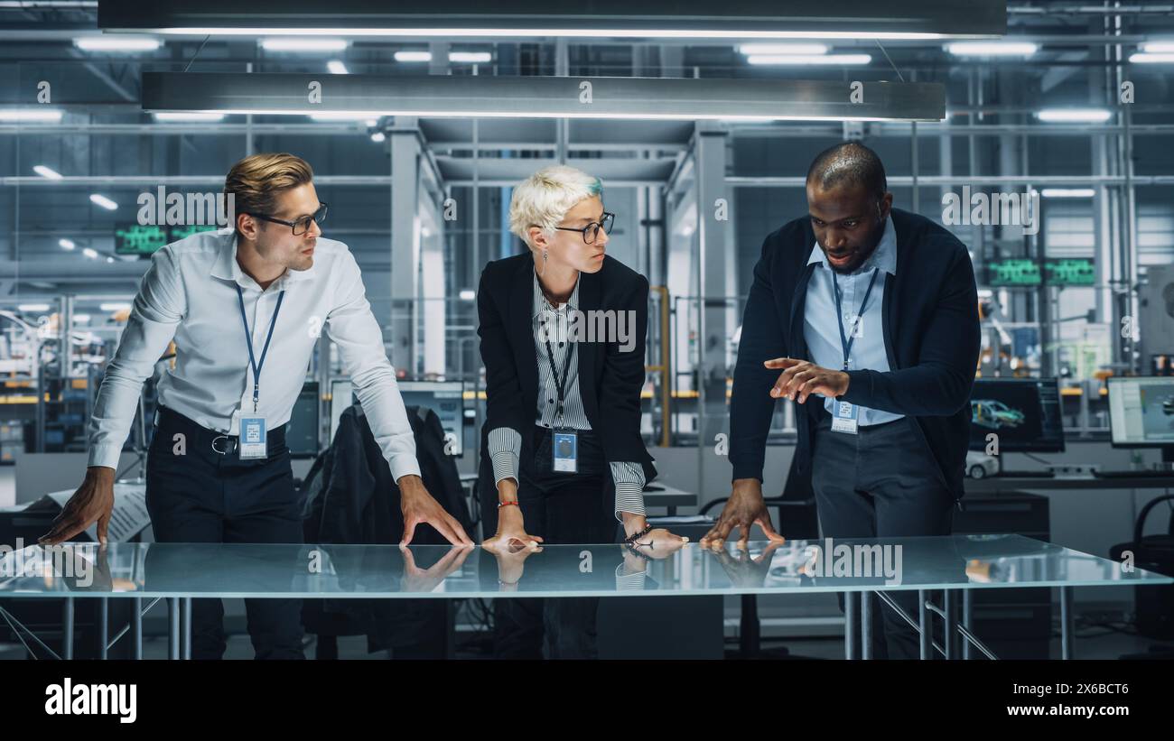 Diverse Team of Automotive Engineers Working in Office at Car Factory ...