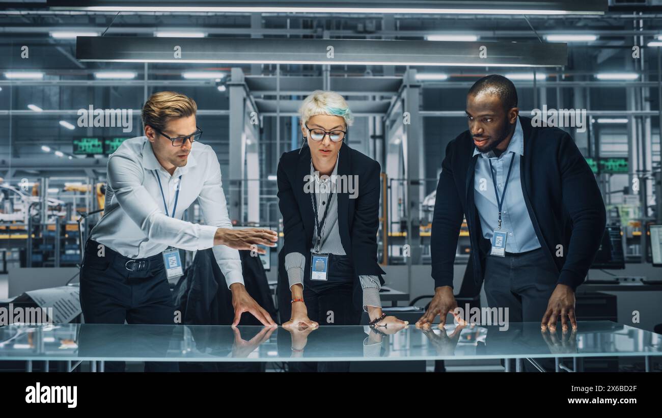 Diverse Team of Automotive Engineers Working in Office at Car Factory ...