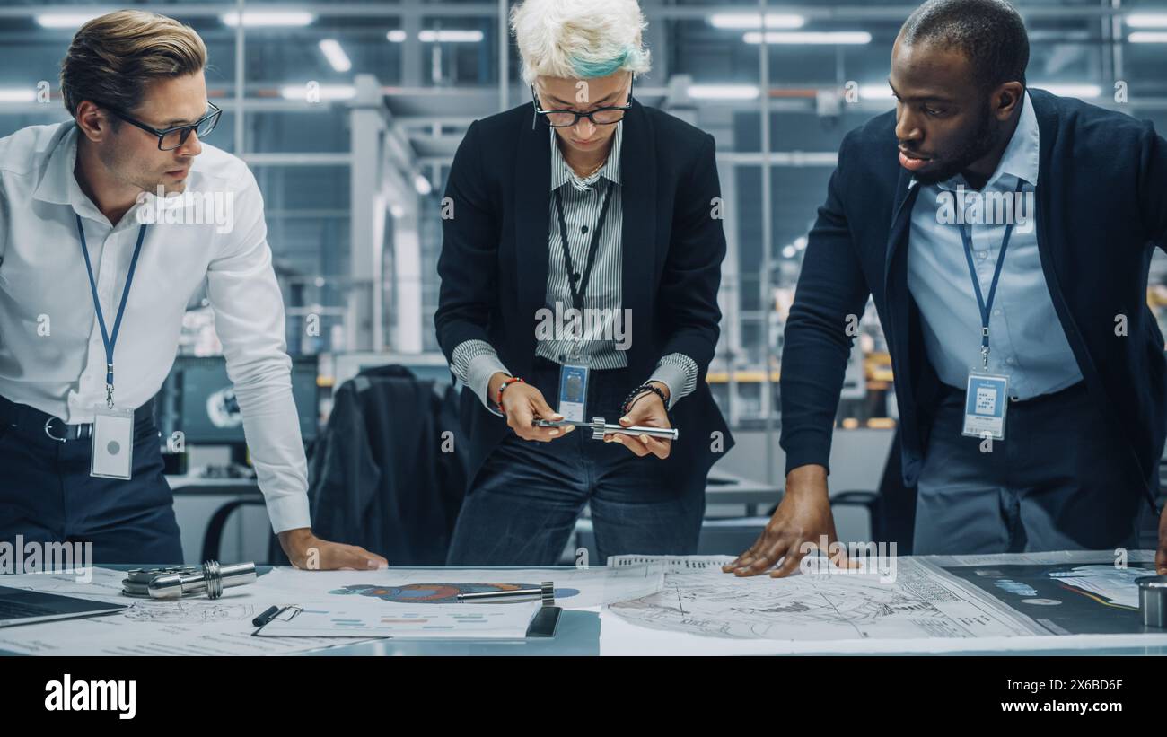 Young Diverse Team of Automotive Engineers Working in Office at Car Factory. Industrial Designer ...