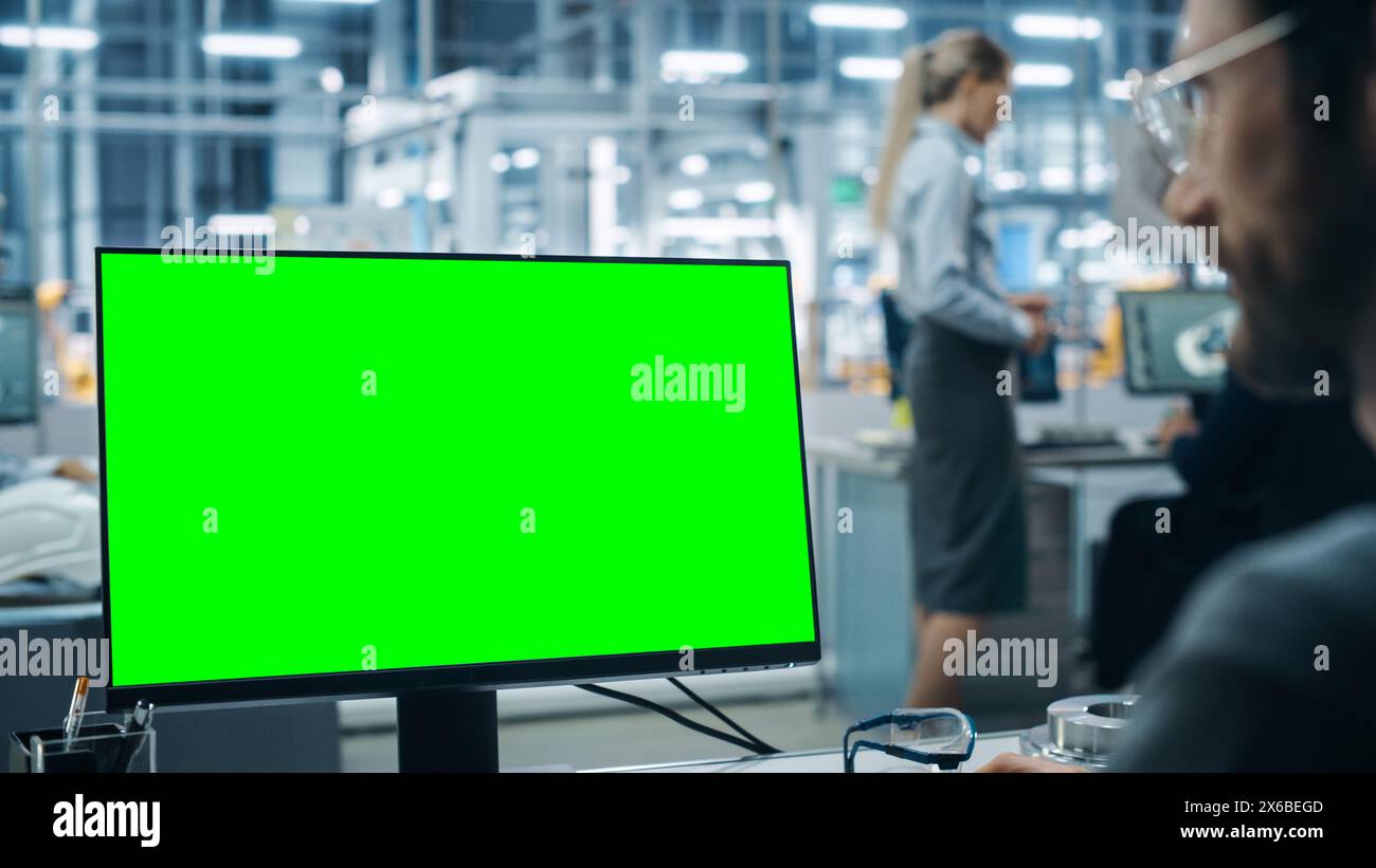 Car Factory Office: Caucasian Male Automotive Engineer Sitting at His ...