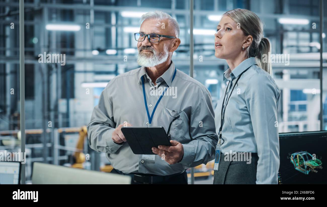 Car Factory: Female Project Manager Talks to Male Automotive Engineer ...