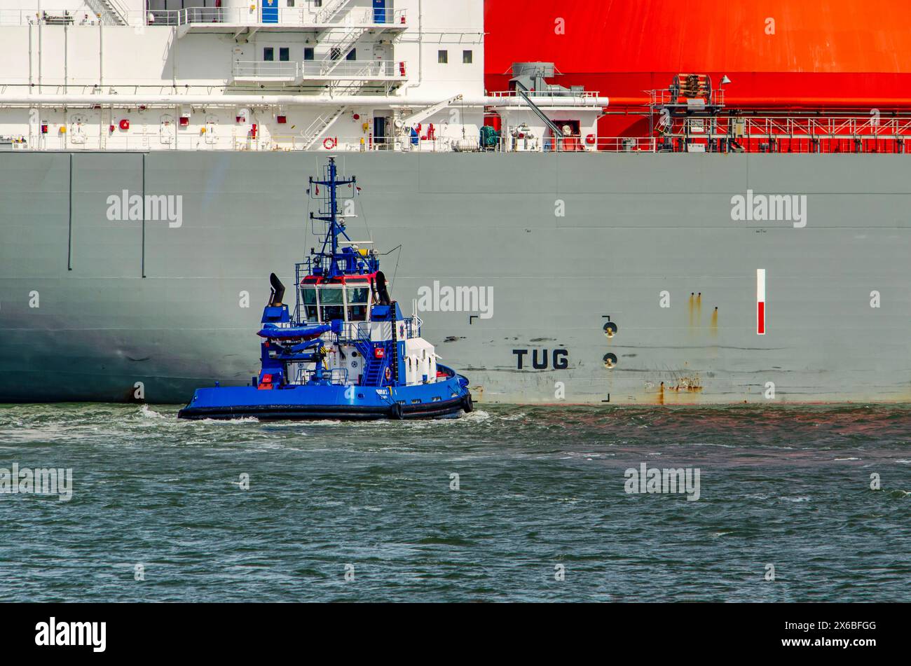 Rotterdam, The Netherlands, April 13, 2024: a small tugboat ready to ...
