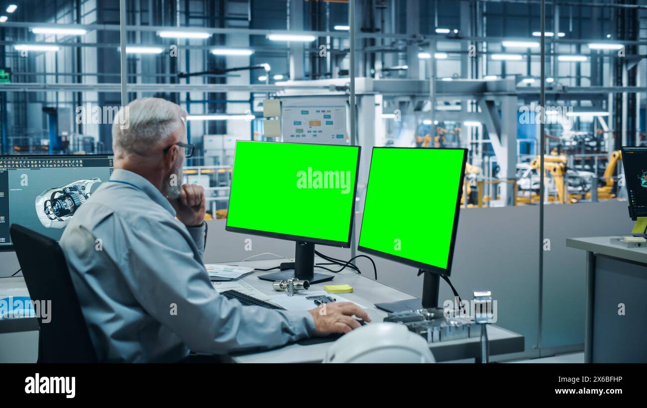Car Factory Monitoring Office: Male Chief Automotive Engineer Sitting ...