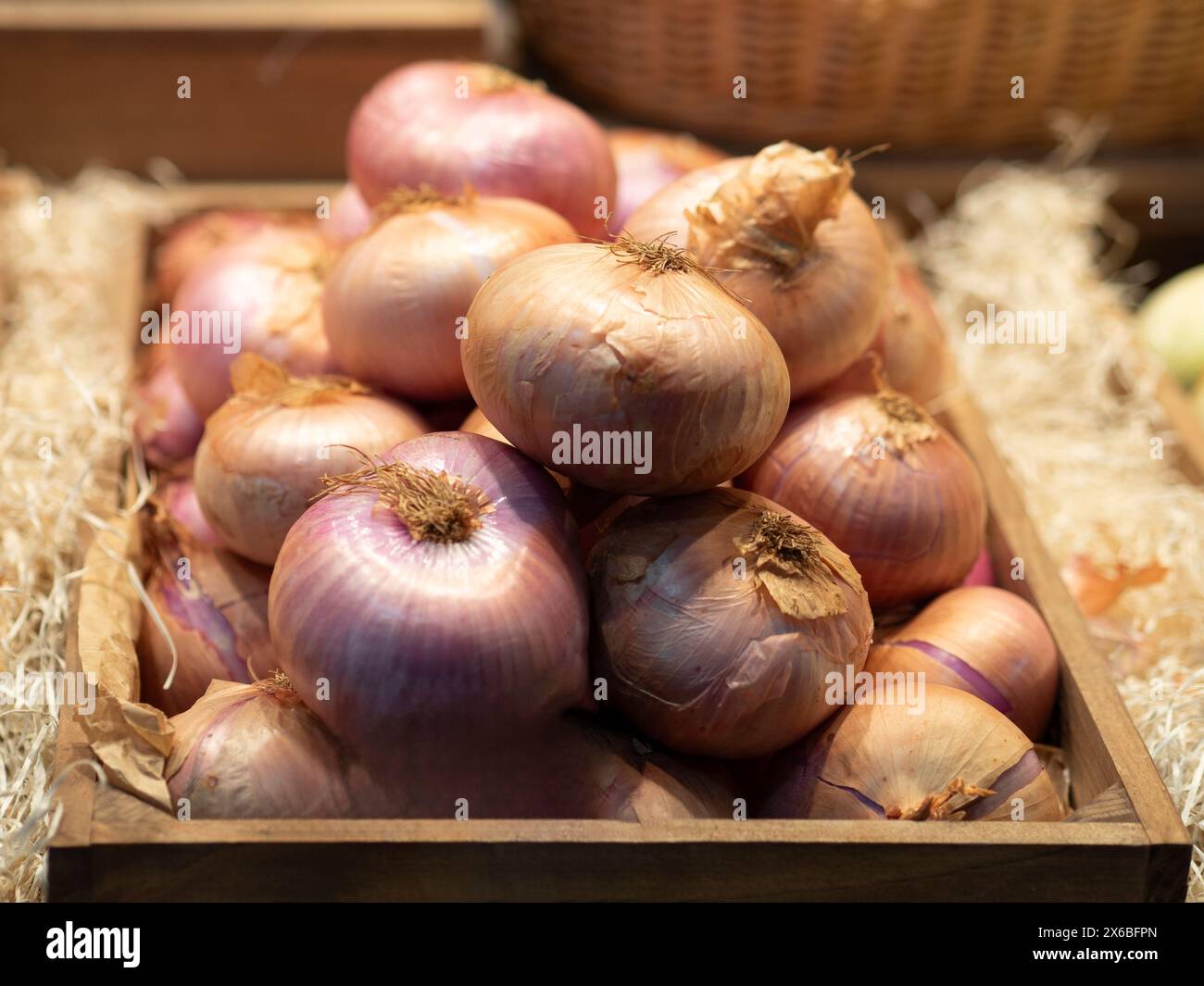 Basket of onions on display for sale at the market Stock Photo - Alamy