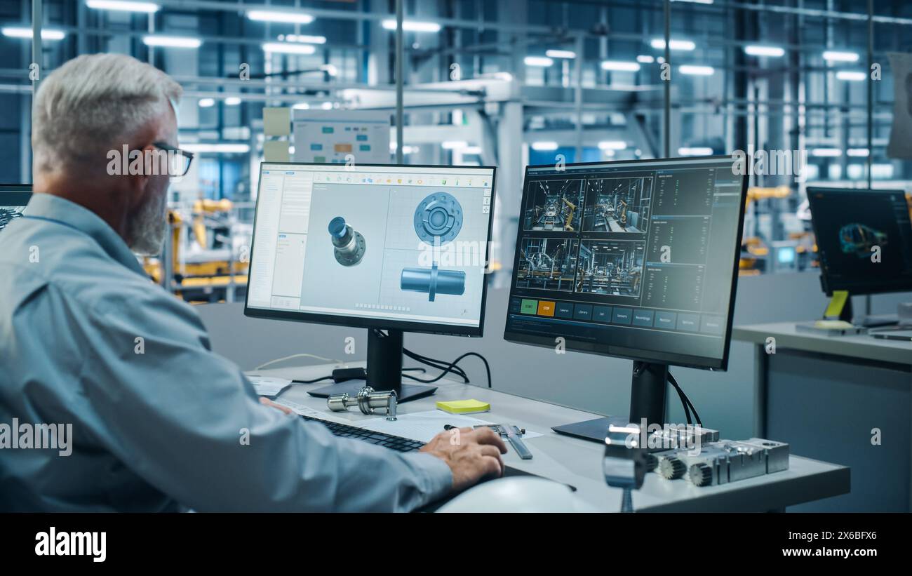 Car Factory Office: Male Chief Automotive Engineer Sitting at His Desk ...