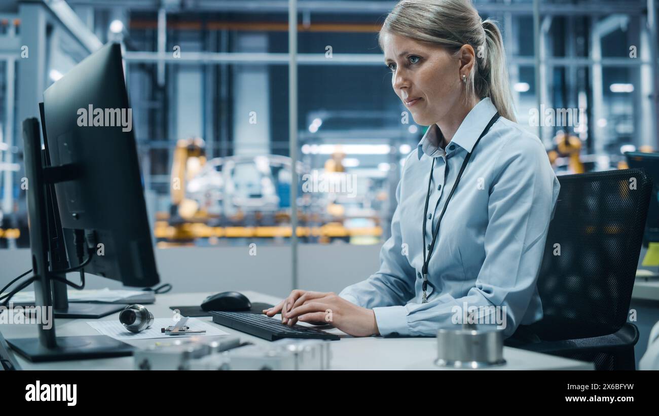 Car Factory Office: Portrait of Confident Female Chief Engineer Working ...