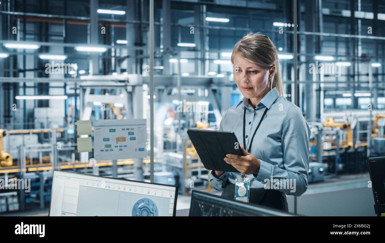 Car Factory Office Concept: Portrait of Successful Female Chief Automotive Engineer Using Tablet ...