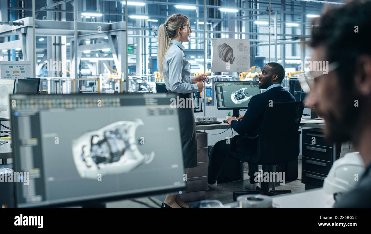 Car Factory Office: Engineer Working on Turbine Prototype on Computer ...