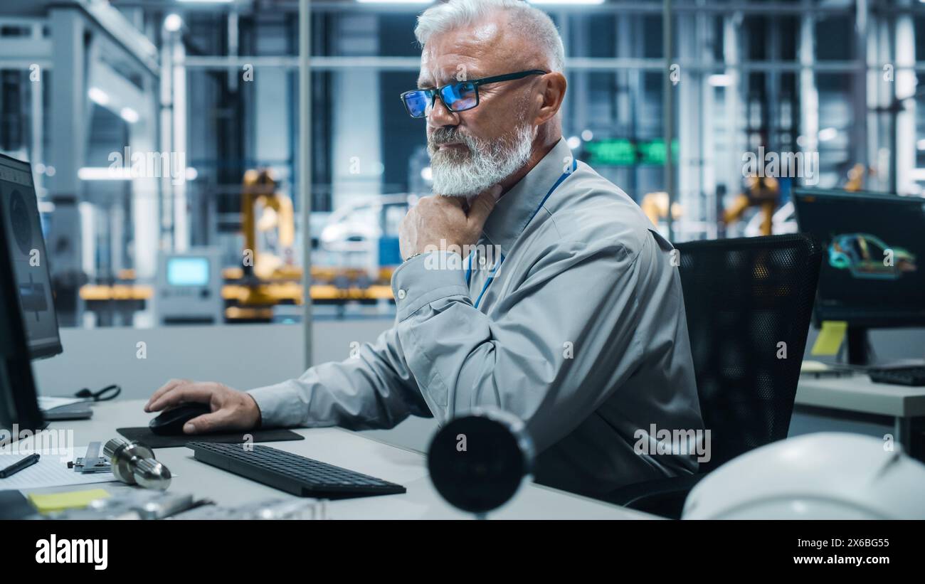 Car Factory Office: Portrait of White Male Chief Engineer Working on ...